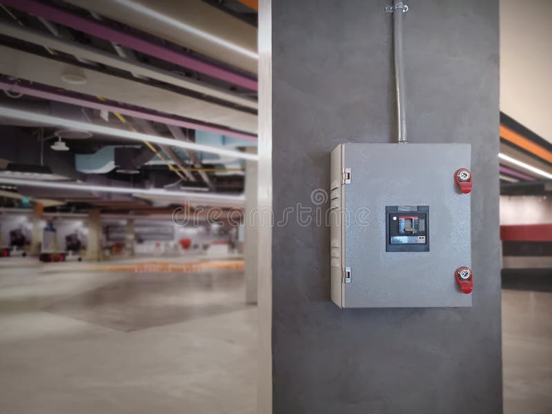 Locked Electrical Control Box Mounted on Concrete Post Against Blurred ...