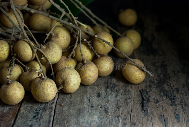 Close Up of Longan Fruit is Placed on a Rustic Wooden Floor Stock Photo ...