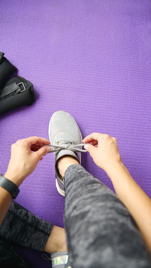 Close Up Looking Down on Woman about To Exercise Tying Shoelaces Stock ...