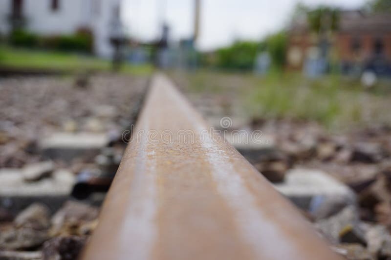 A Close-up, Low-angle Shot of a Rusty Railroad Track, Highlighting the ...