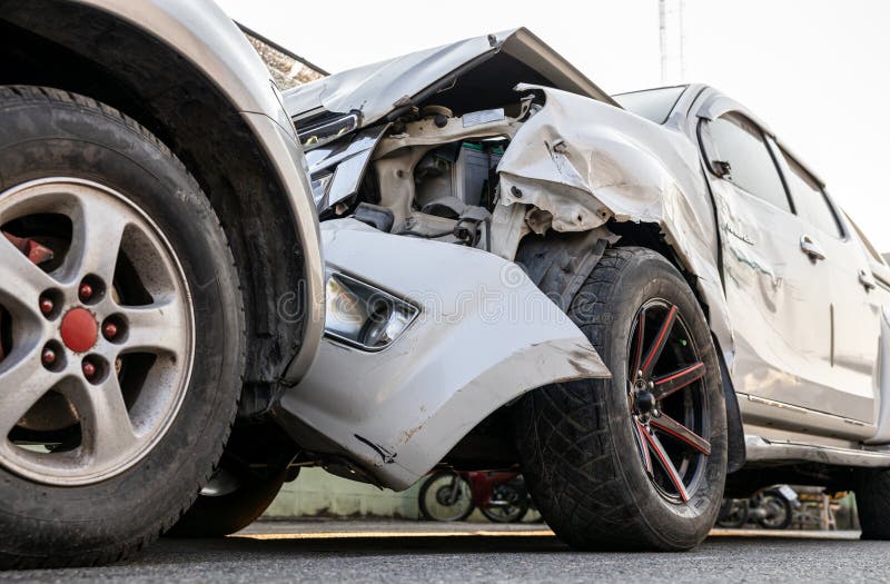Close-up, Low Angle View of the Front Side Wheels of a White Car Which ...