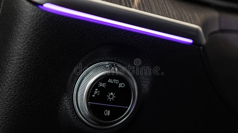 Close-up of a Luxury Car Dashboard Featuring a Headlight Control Dial ...