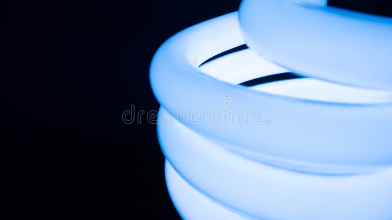 Close Up Macro of CFL Energy Saving Bulb Emitting Blue Glow. Stock ...