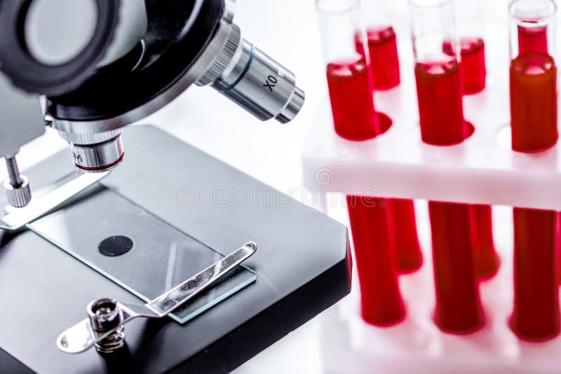 Close Up Macro Microscope with Blood Sample on White Background Stock ...