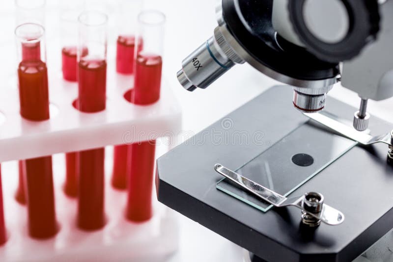 Close Up Macro Microscope with Blood Sample on White Background Stock ...