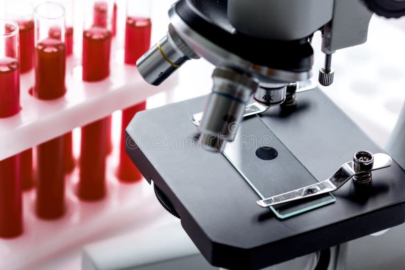 Close Up Macro Microscope with Blood Sample on White Background Stock ...