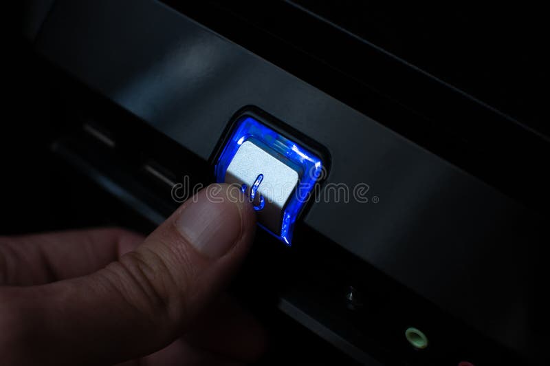 Close Up Macro Shot of the Press the Power Button on Computer. Turn on ...