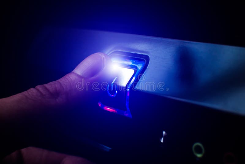 Close Up Macro Shot of the Press the Power Button on Computer. Turn on ...