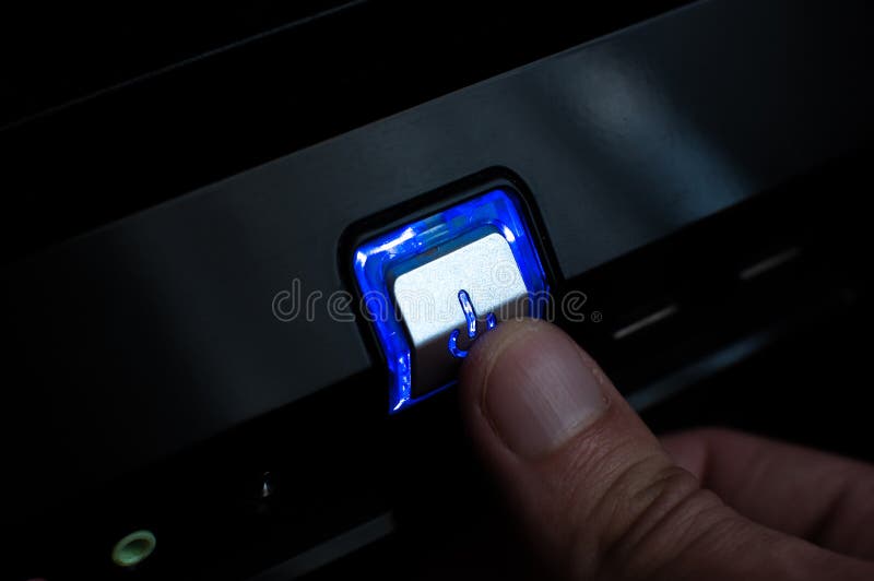 Close Up Macro Shot of the Press the Power Button on Computer. Turn on ...