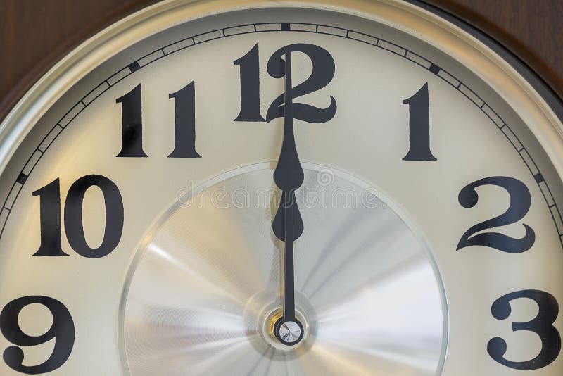 Close Up Macro View of Brown Clock with Light Clock Face Showing Twelve ...