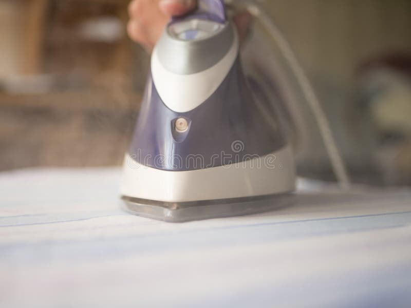 Close Up Maid Hand in the Hotel Ironing Clothes in Hotel Room White ...