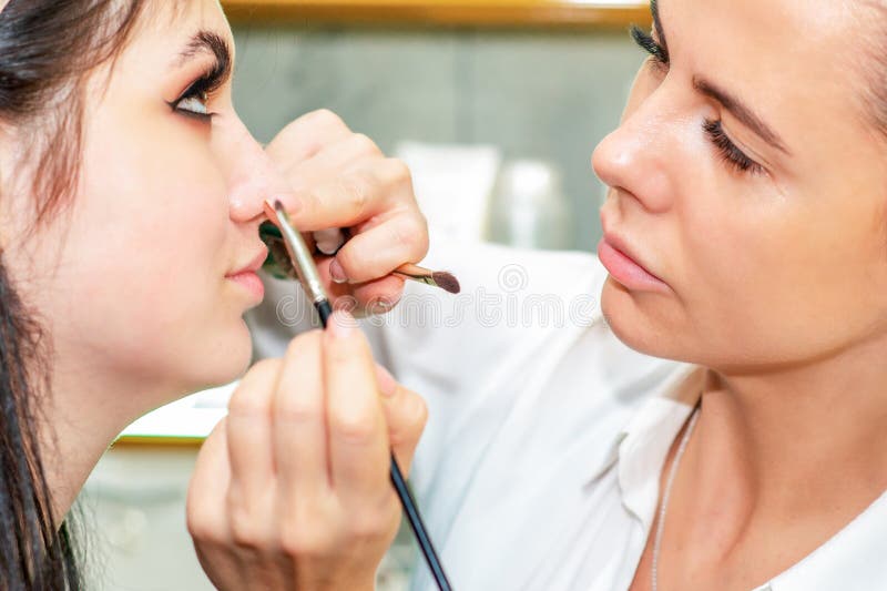 Makeup on face of woman stock image. Image of brown - 182563535