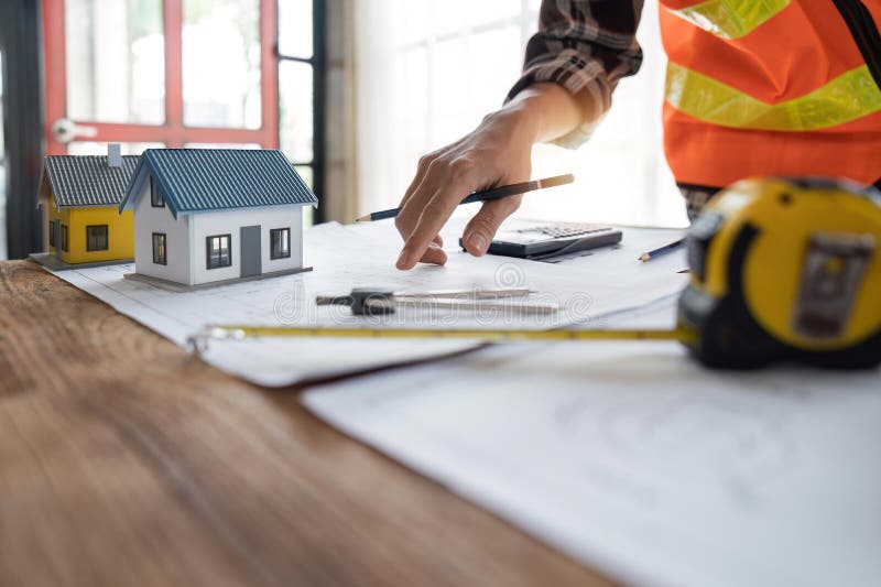 Engineer Working in Office with Blueprints, Inspection in Workplace for ...