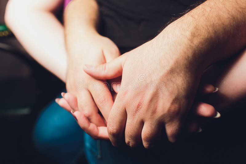Close Up Male and Female Holding Hands Over Table. Stock Photo - Image ...