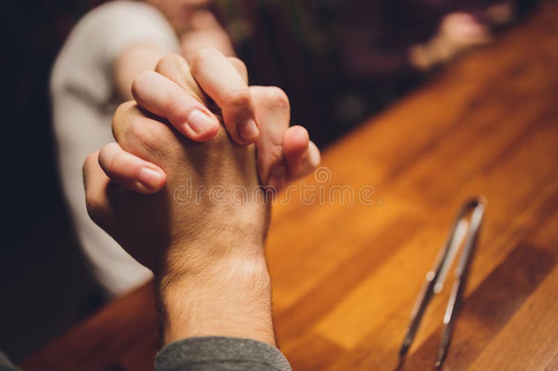 Close Up Male and Female Holding Hands Over Table. Stock Photo - Image ...
