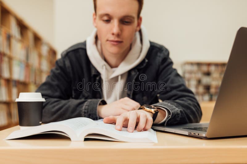 Close Up of Male Hand on a Book. University Student Reading from Book ...