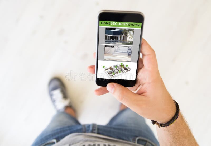 Man Looking at Home Security Cameras on Tablet Computer Stock Photo ...