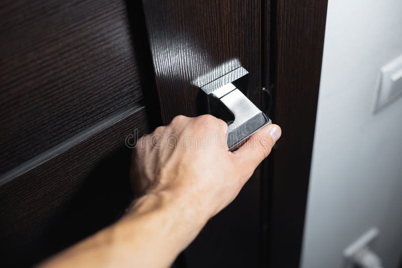 Close-up of Male Hand Opening the Door. Stock Photo - Image of doorknob ...