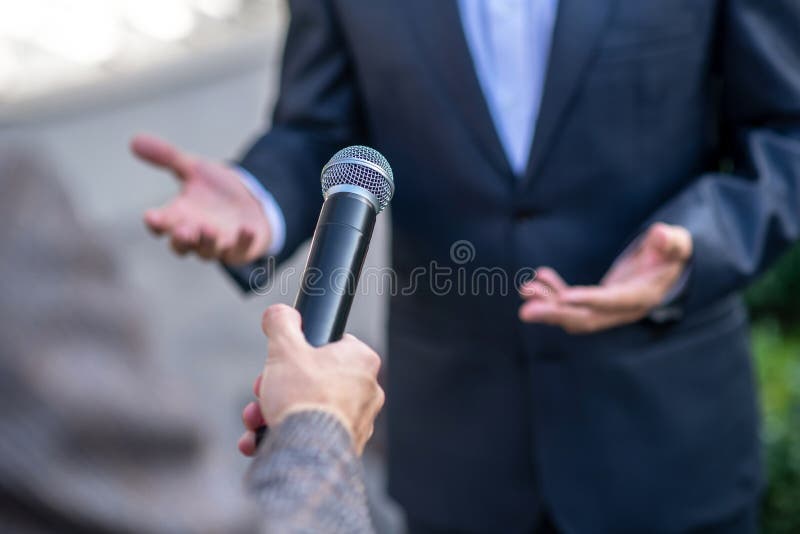 Close-up of Male Hands Holding Microphone during Interview Stock Image ...