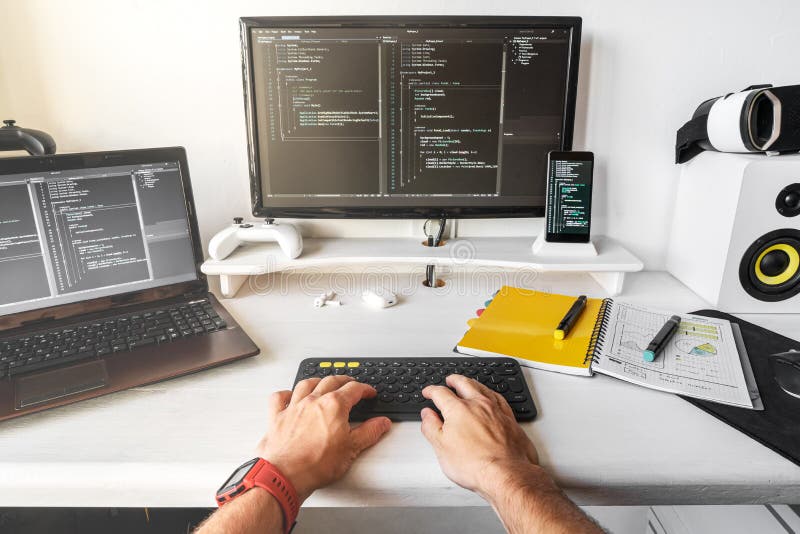 Close-up of Male Hands on the Laptop at Modern Developer Workplace for ...