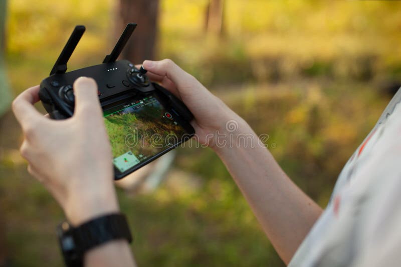 Close Up of Male Hands Operating a Drone with Remote Control. Stock ...