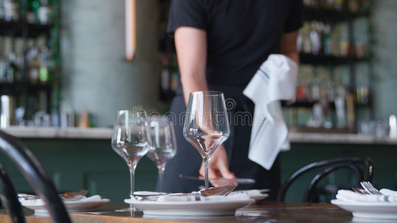 Close Up of Male Server Laying Place Setting on Restaurant Table Stock ...