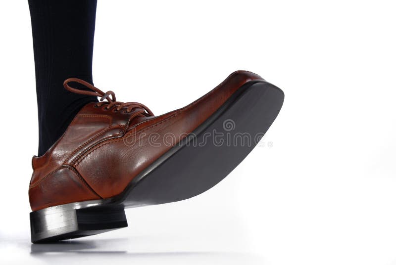Close-up of Male Shoe Stepping on White Background Stock Image - Image ...