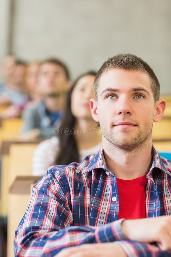 Close Up of a Male Student with Others in Classroom Stock Photo - Image ...