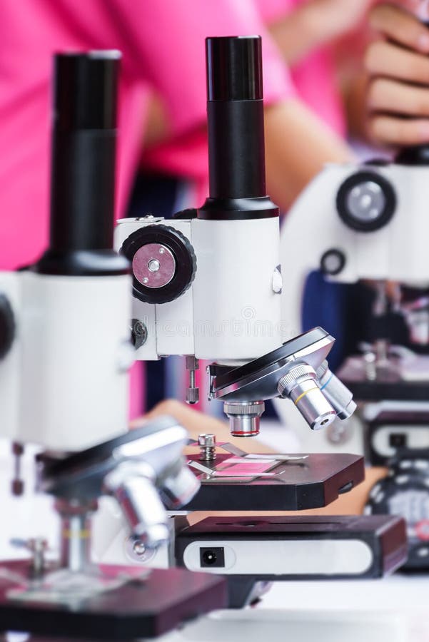 Close-up of a Male Student Using Microscope Stock Photo - Image of ...