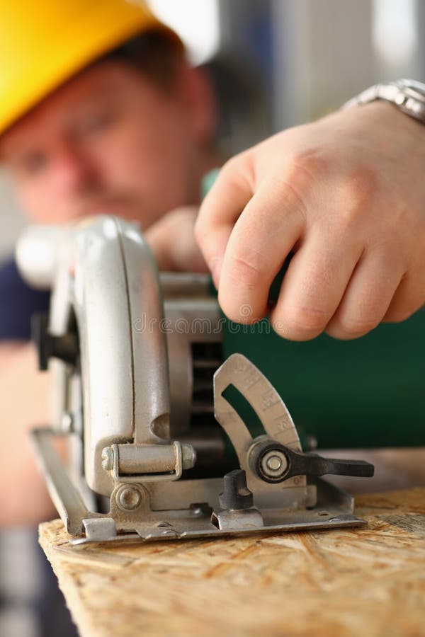 Male Worker Using Electric Saw Tool, Improvement on Construction Site ...