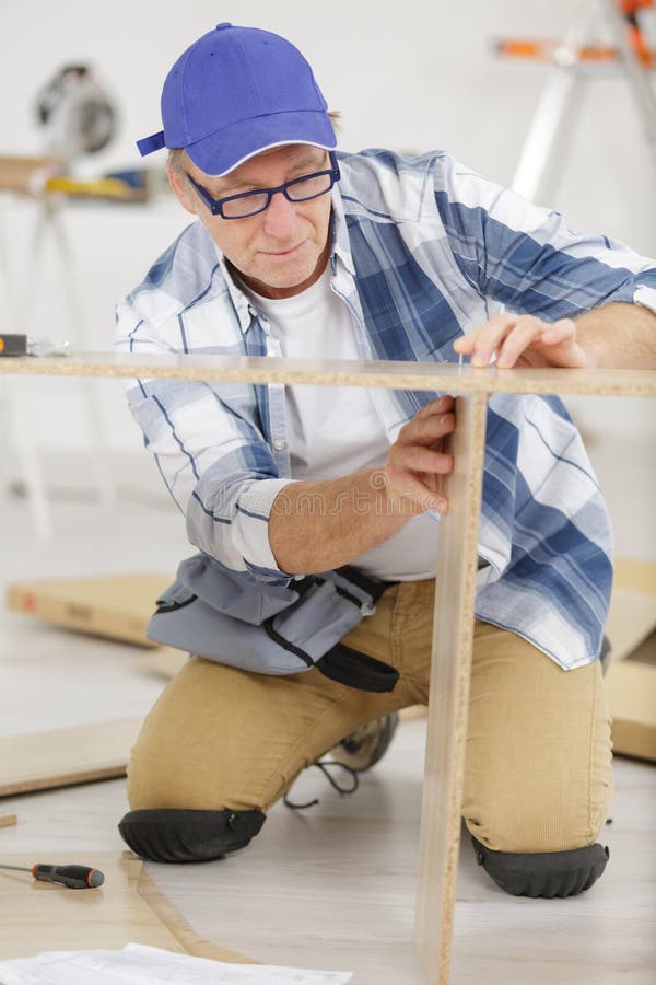 Close-up Man Building Furniture Stock Photo - Image of sawing, indoors ...