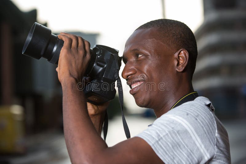 Close-up of Man with Camera, Smiling Stock Photo - Image of african ...
