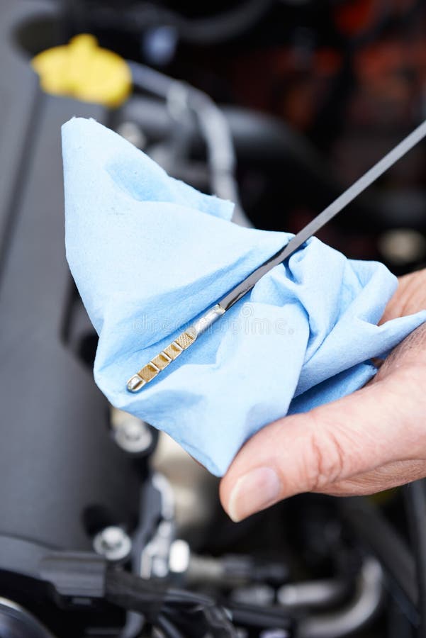 Close-Up of Man Checking Car Engine Oil Level on Dipstick Stock Image ...