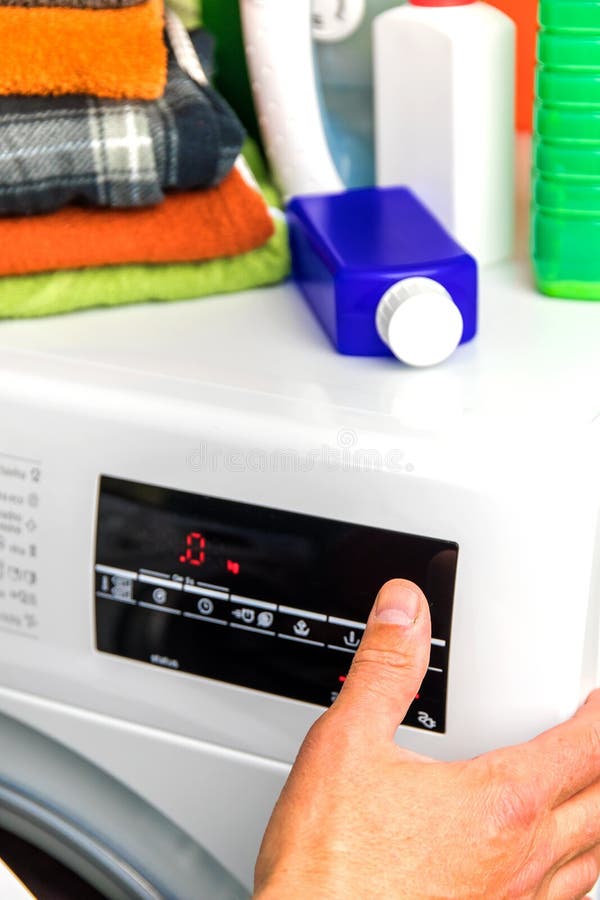Close Up of Man Choosing Cycle Program on Washing Machine. Adjusting ...