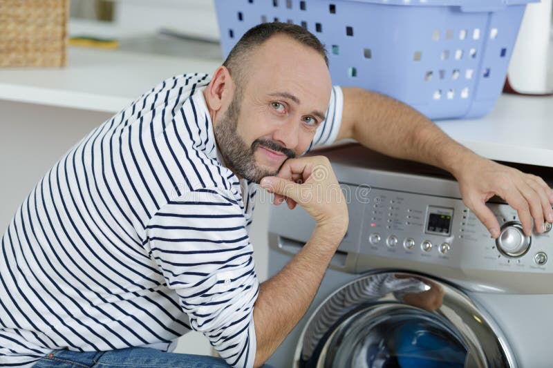 Close Up Man Choosing Cycle Program on Washing Machine Stock Image ...