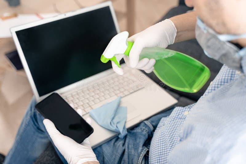 Close Up of Man Cleaning and Sanitizing Tech Devices Stock Image ...