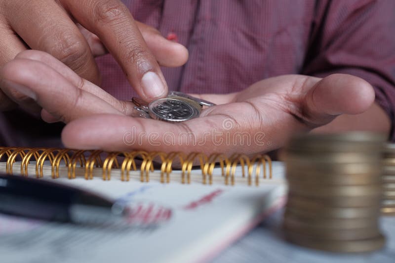 Close Up of Man Counting Coins on Table Stock Photo - Image of stacking ...