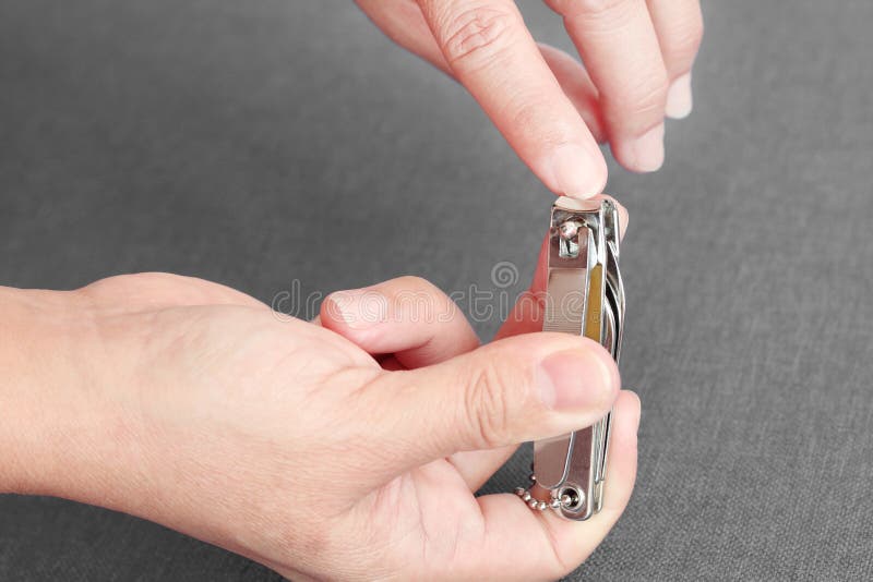 Close Up of Man Cutting Fingernails Using Nail Clipper Stock Image ...