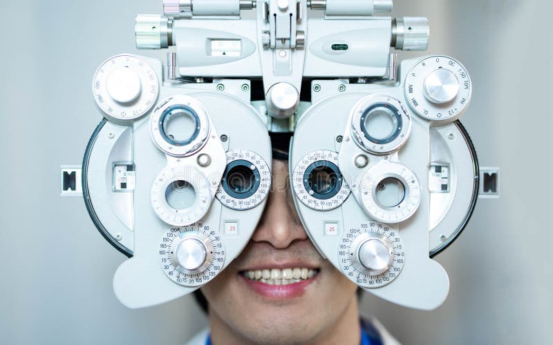 Close-up of a Man Doing Eye Test on Phoropter, Male Checking on Her Eye ...