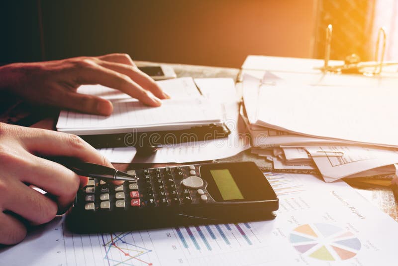 Close Up Man Doing Finance and Using Calculator in Home Office. Stock ...