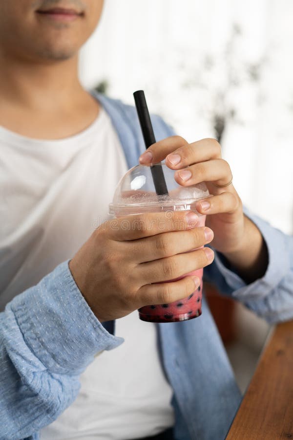 Close-up of Man Drinking Cold Bubble Tea in Cafe Stock Photo - Image of ...