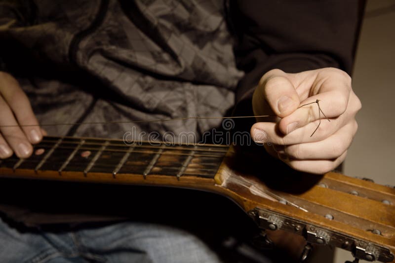 Close-up of a Man with a Guitar String is Torn Stock Image - Image of ...