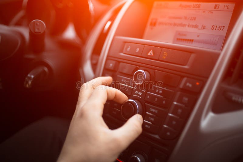 Close-up of Man Hand Adjusts the Volume Control of Car Audio System ...