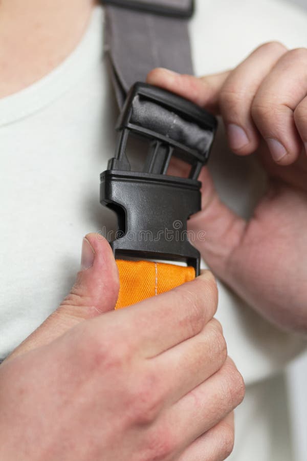 Close-up Man Hand Fastens Strap of Overalls on Shoulder , an Element of ...