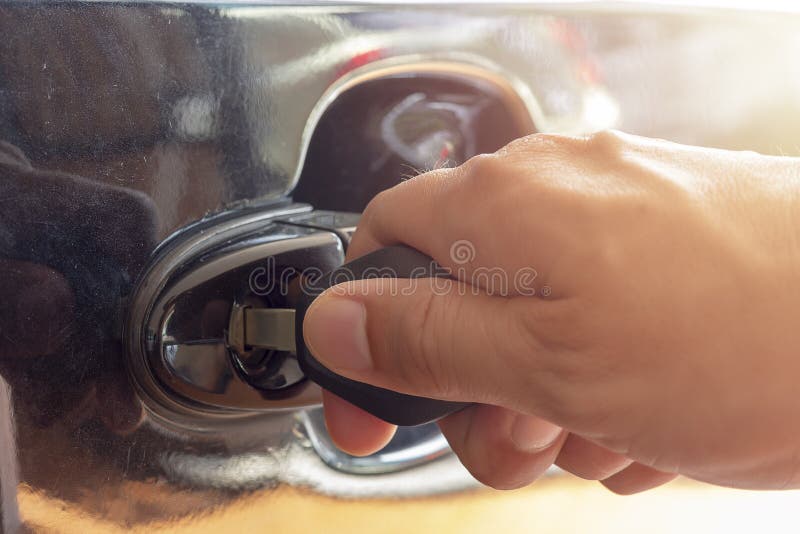 Close Up Man Hand Inserting a Key into the Door Lock a Car Stock Image ...