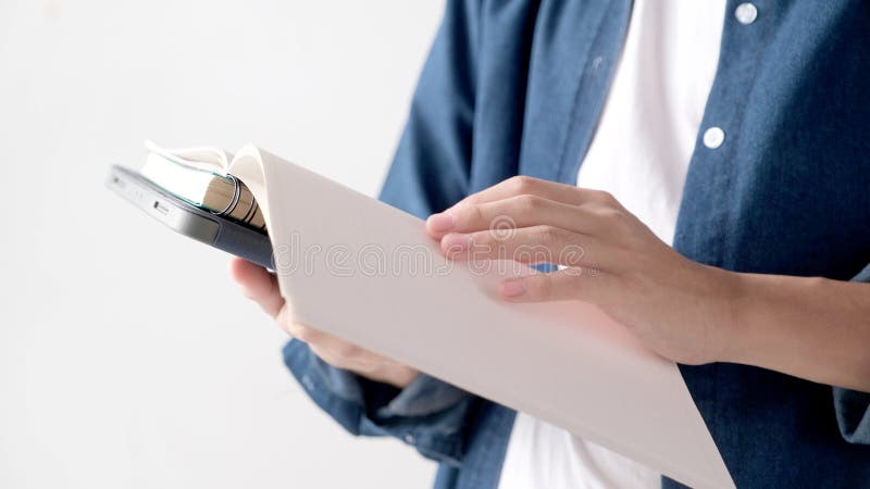 Close Up of Man Hand Opening Book for Reading while Standing Over White ...