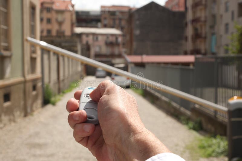 Close Up on Man Hand Opening a Gate with a Remote Control Stock Image ...