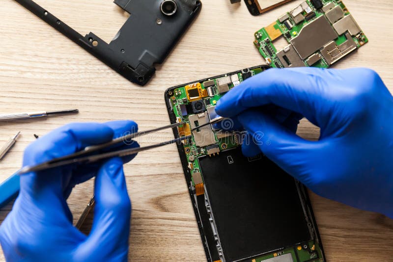 Technician Repairing Mobile Phone at Table, Closeup Stock Image - Image ...