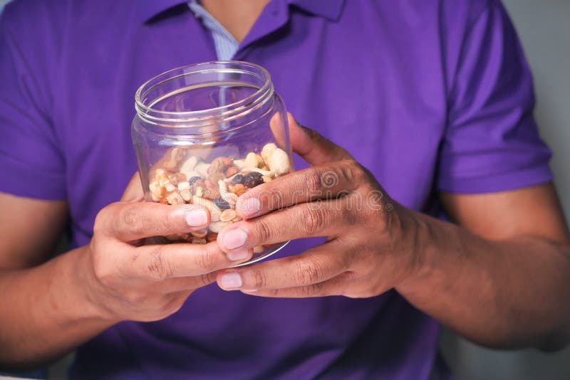 Close Up of Man Hand`s Eating Mixed Nut Stock Photo - Image of walnut ...