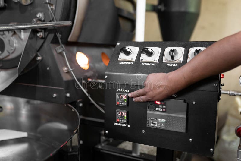 Close Up of a Man Hand Setting the Buttons of a Coffee Roaster Machine ...